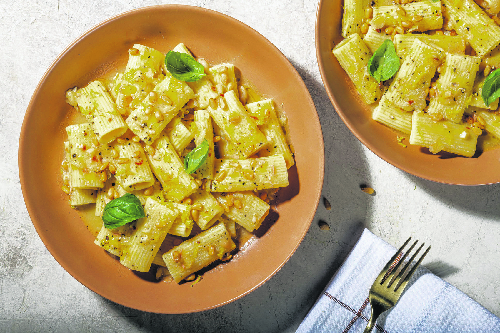 Creamy Cannellini Bean Rigatoni is topped with toasted pine nuts and ...