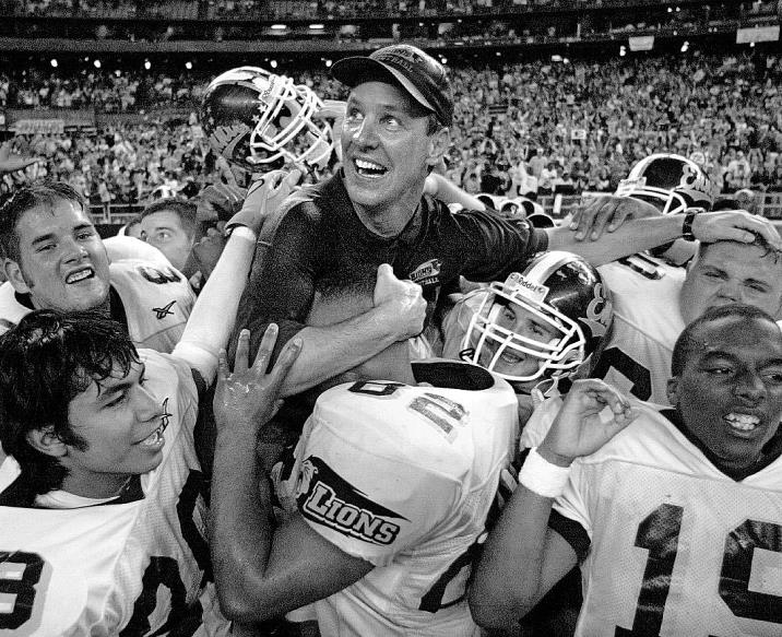 file photo sam harrell was lifted by his ennis players as they ...