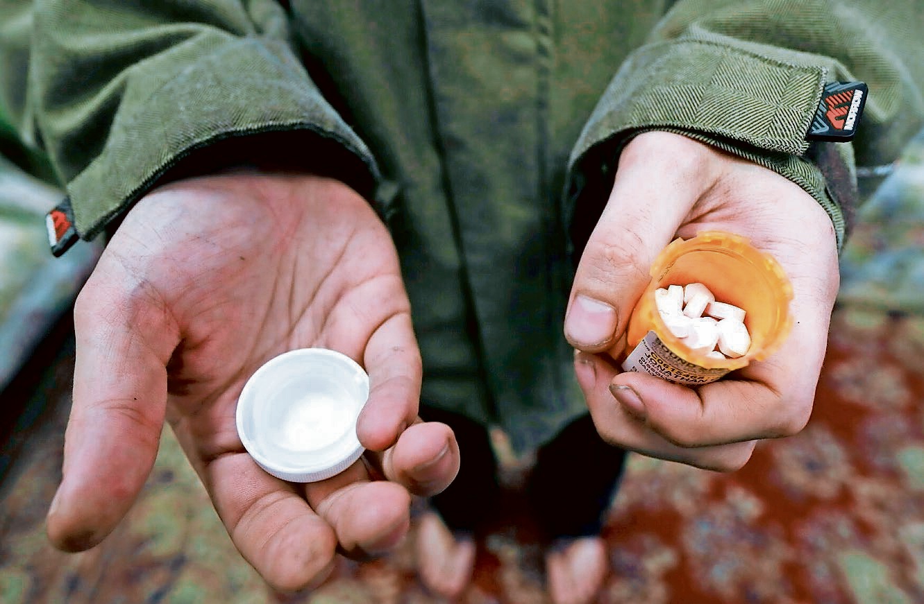 file ap a man holds his bottle of buprenorphine a medicine that ...