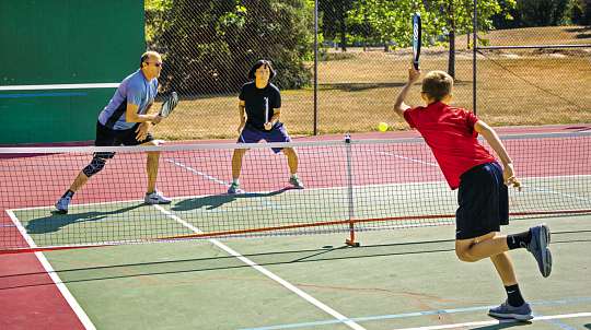 Justin, right, puts away a shot during a recent game against Schilling ...