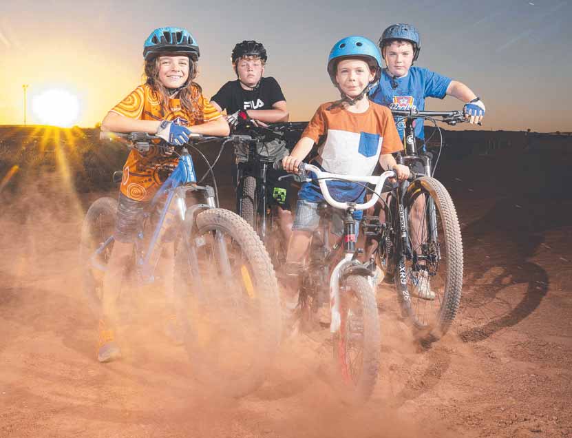 Young racers Xavier Wright, 9, Thomas Troisi, 11, Samuel Lomman, 7, and ...