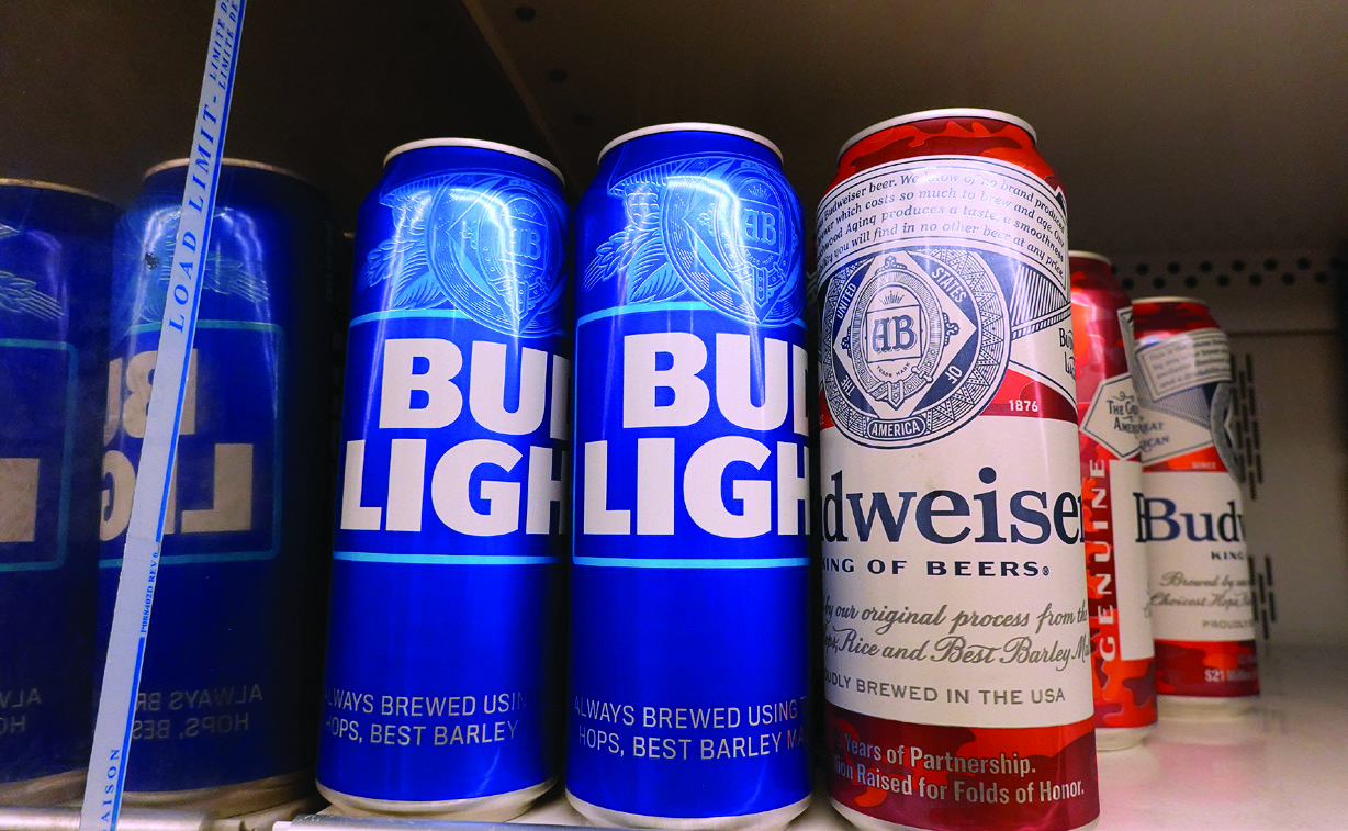 GETTY IMAGES Bud Light, made by Anheuser-Busch, sits on a store shelf ...