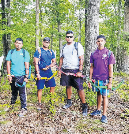 team scoutstt all ready for archery expedition in the woods