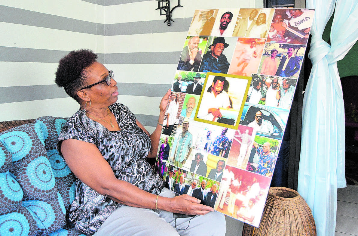 Stephanie Sylvester, the wife of the late Gerard Sylvester, looks at a ...