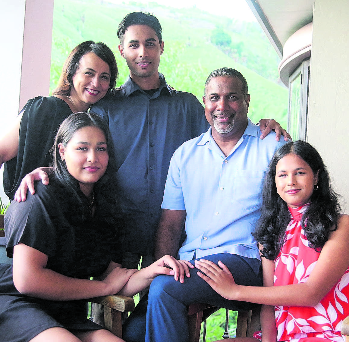 Dinanath Ramnarine, second right, with his wife, Toni, standing left ...