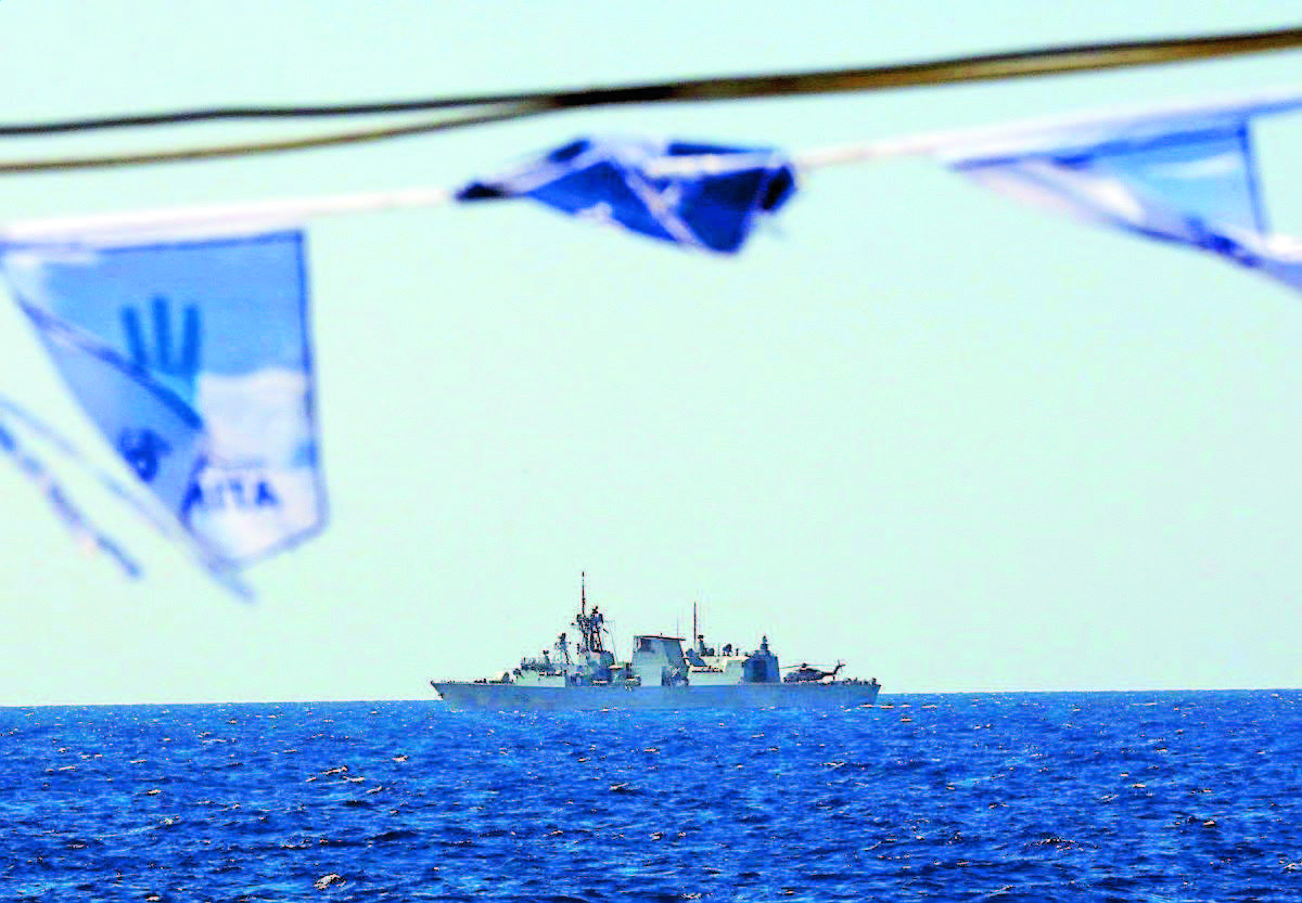 A China Coast Guard vessel shadows MV Kapitan Felix Oca, the main ship ...